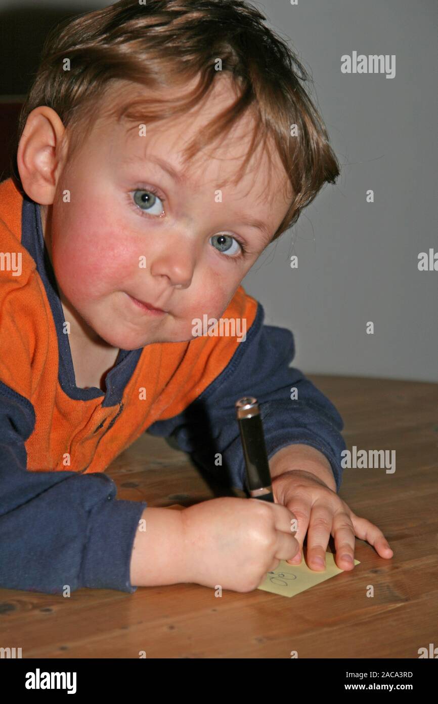 Child with ballpoint pen Stock Photo - Alamy