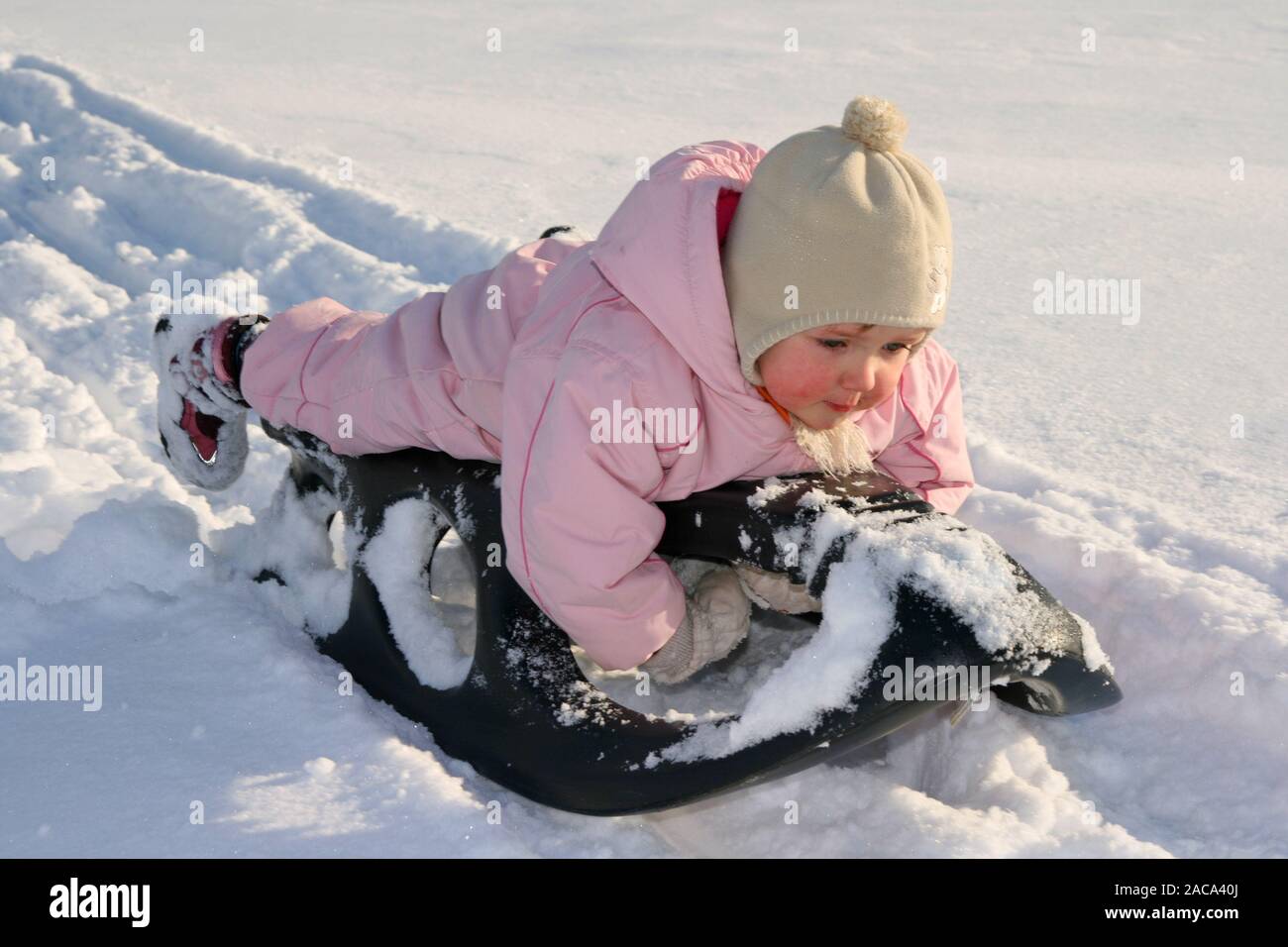 Child with bobsled Stock Photo - Alamy