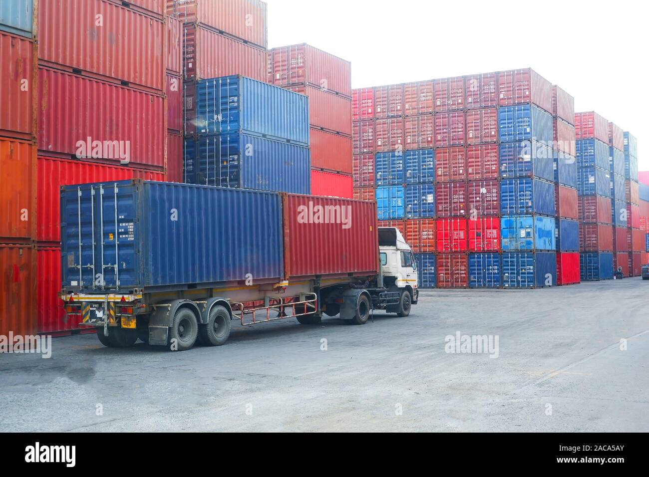 Container trucks in the import and export area at the port Import and ...