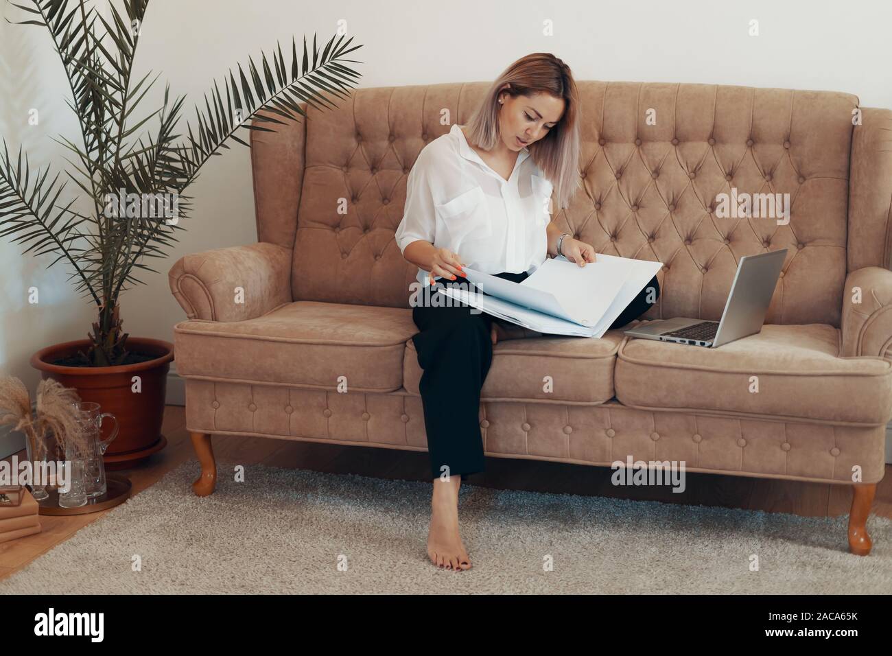 Beautiful business woman working at home. Multi-tasking, freelance and ...