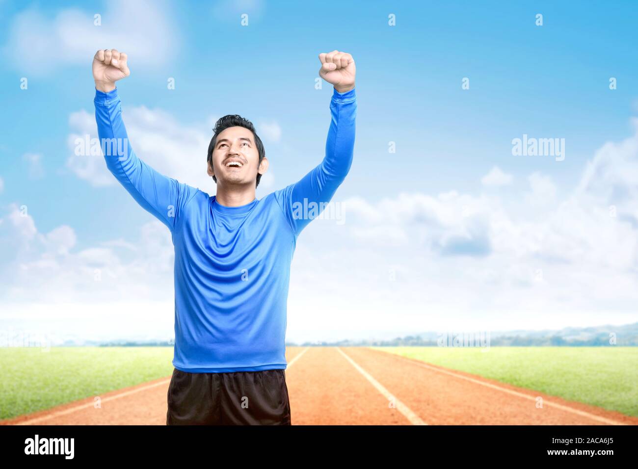 Asian runner man with excited expression after a run on the running ...