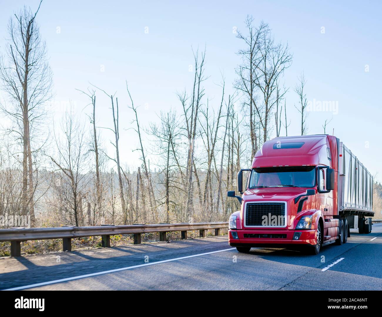 Big rig long haul red semi truck with high cab transporting commercial ...