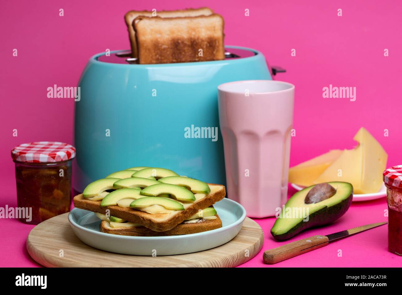 bright, fun breakfast. cyan color toaster on a pink background Stock ...