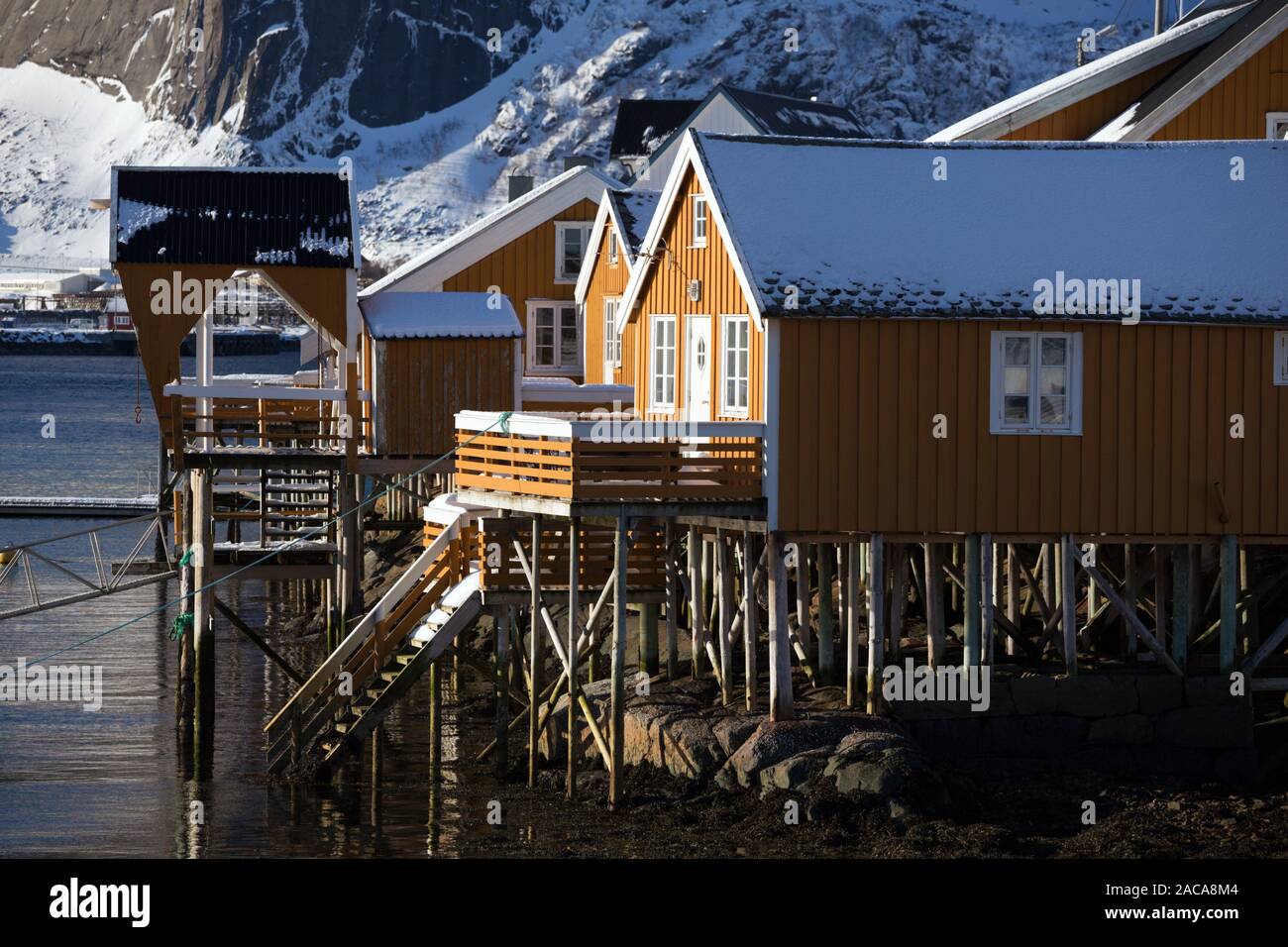 traditional norwegian wooden house rorbu to stand on the shore of the ...