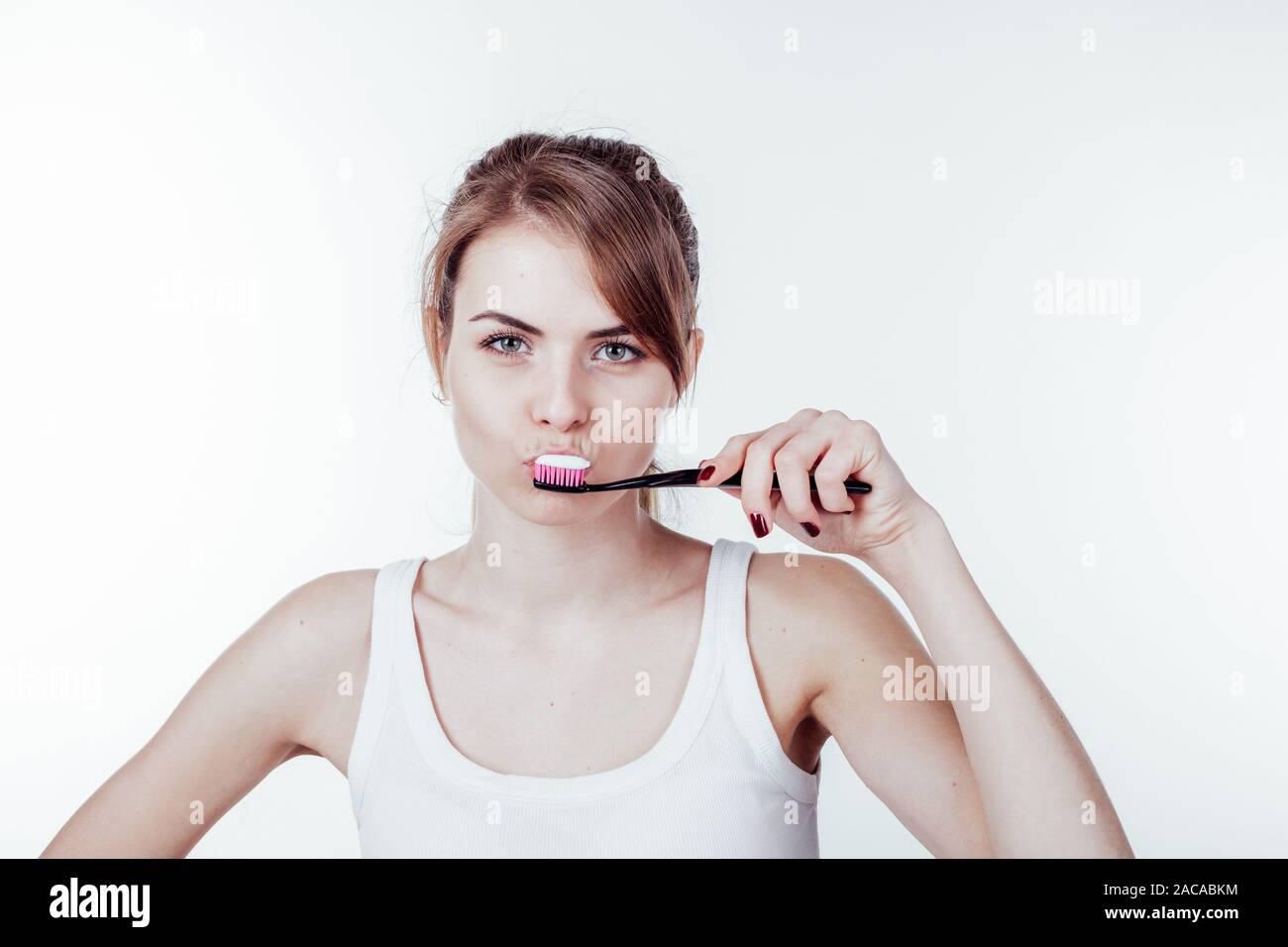 girl with a toothbrush white teeth dentistry Stock Photo - Alamy