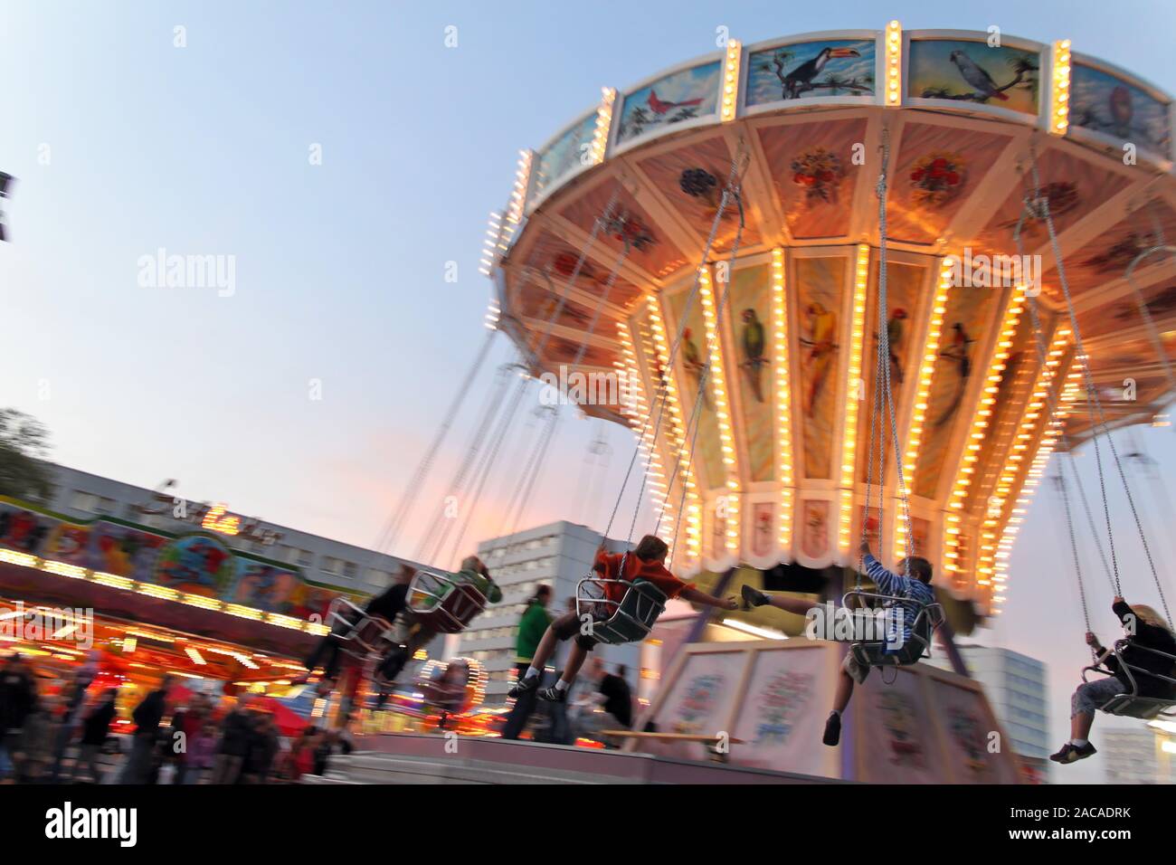 Rotating carousel on a fairground Stock Photo - Alamy