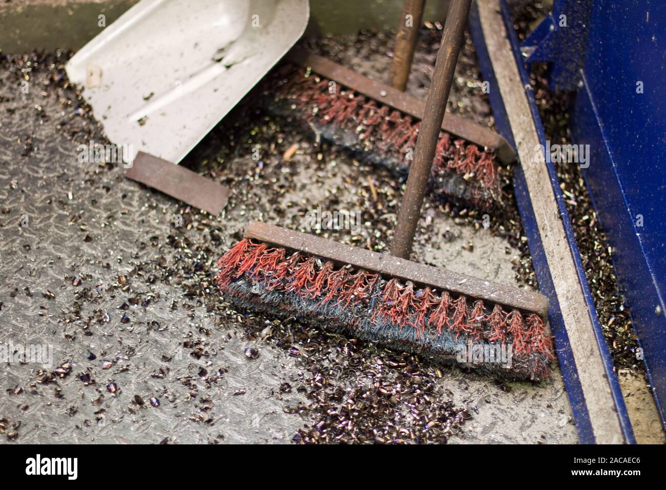 Brooms and metal shavings in the metal industry Stock Photo - Alamy
