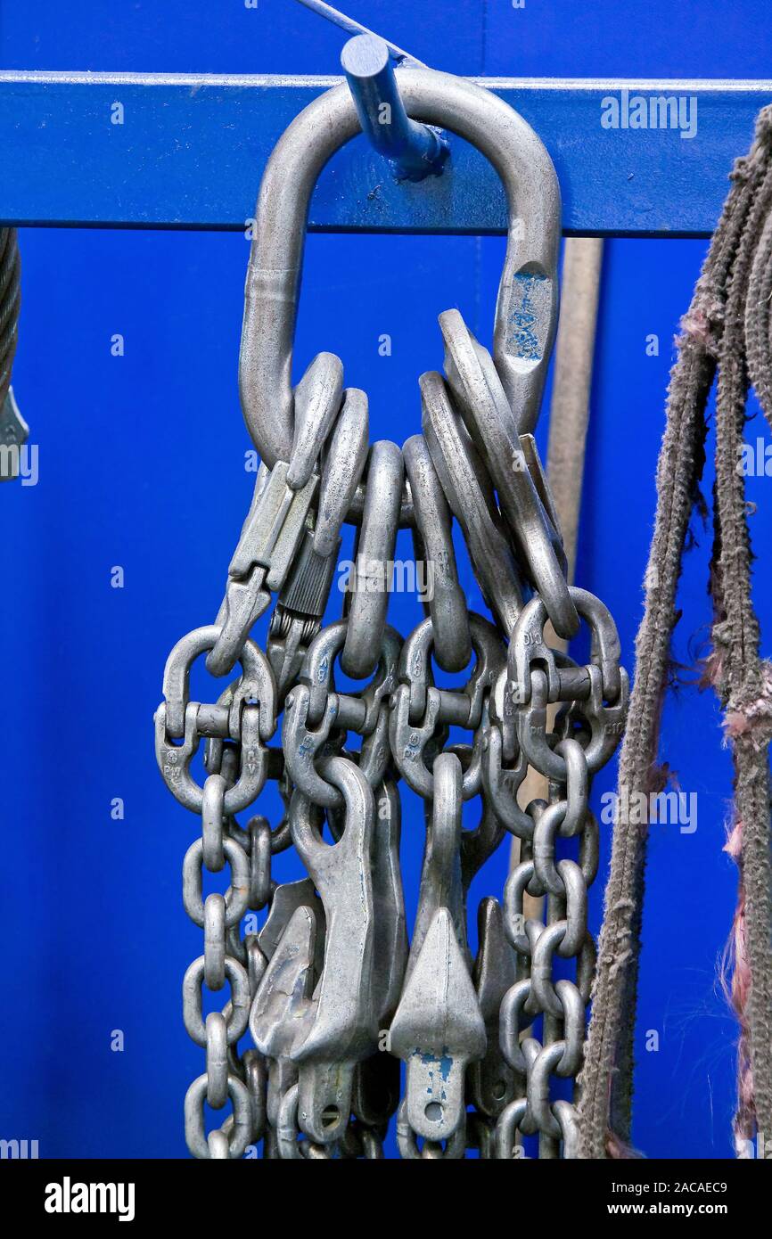 Strong steel chains in a workshop Stock Photo - Alamy