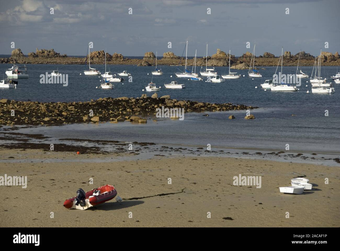Boats between rocks in the sea Stock Photo - Alamy