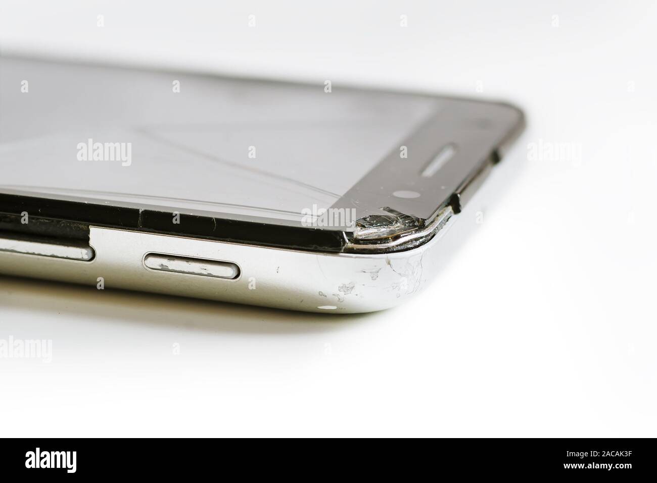 Old phone with broken screen isolated on white background Stock Photo ...