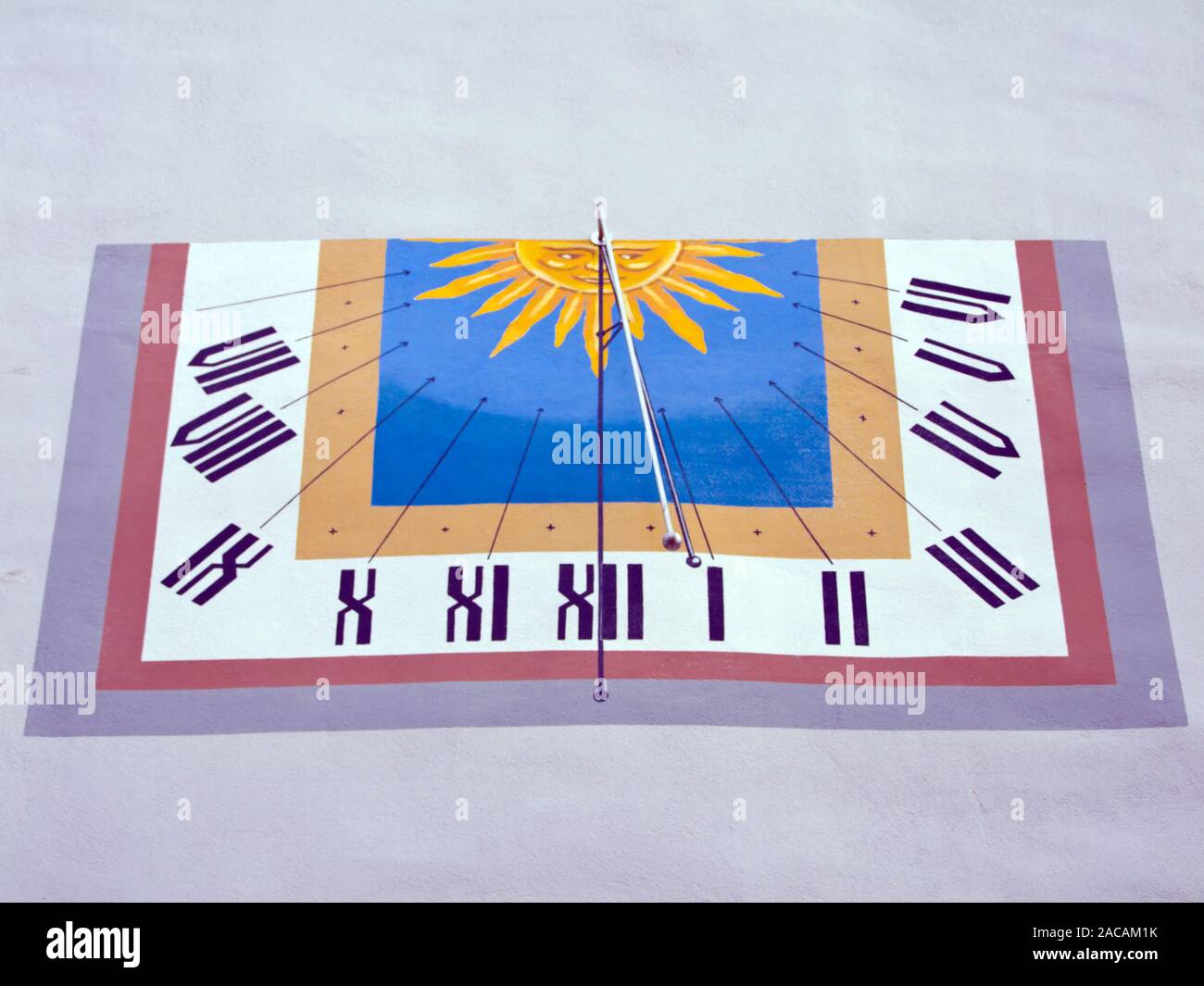 Sundial on a house facade Stock Photo - Alamy