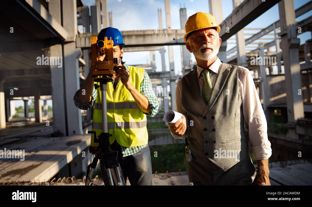 Confident team of architects and engineers working together on ...