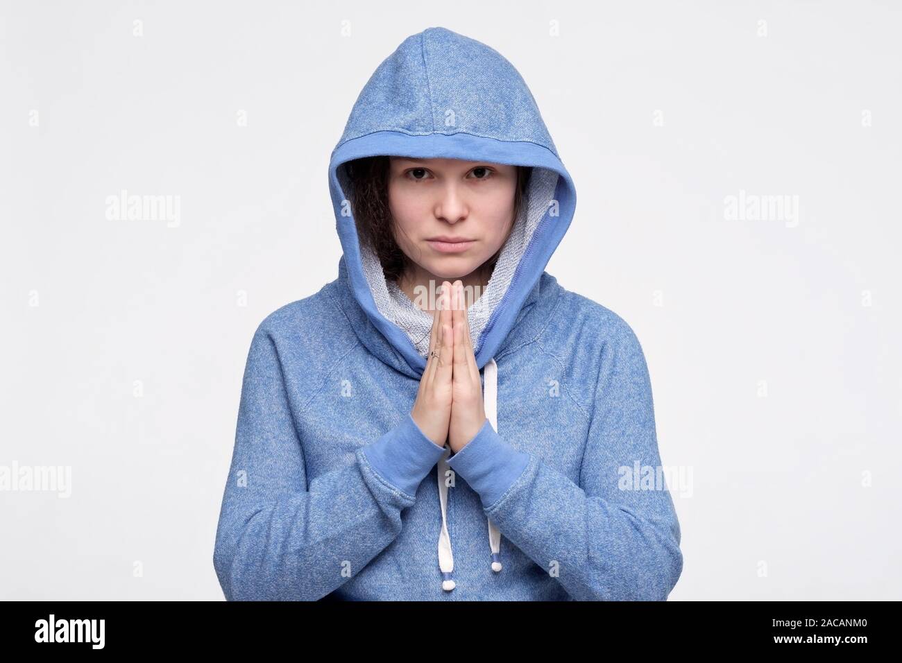 Caucasian pretty female teenager asking for help begging for mercy ...