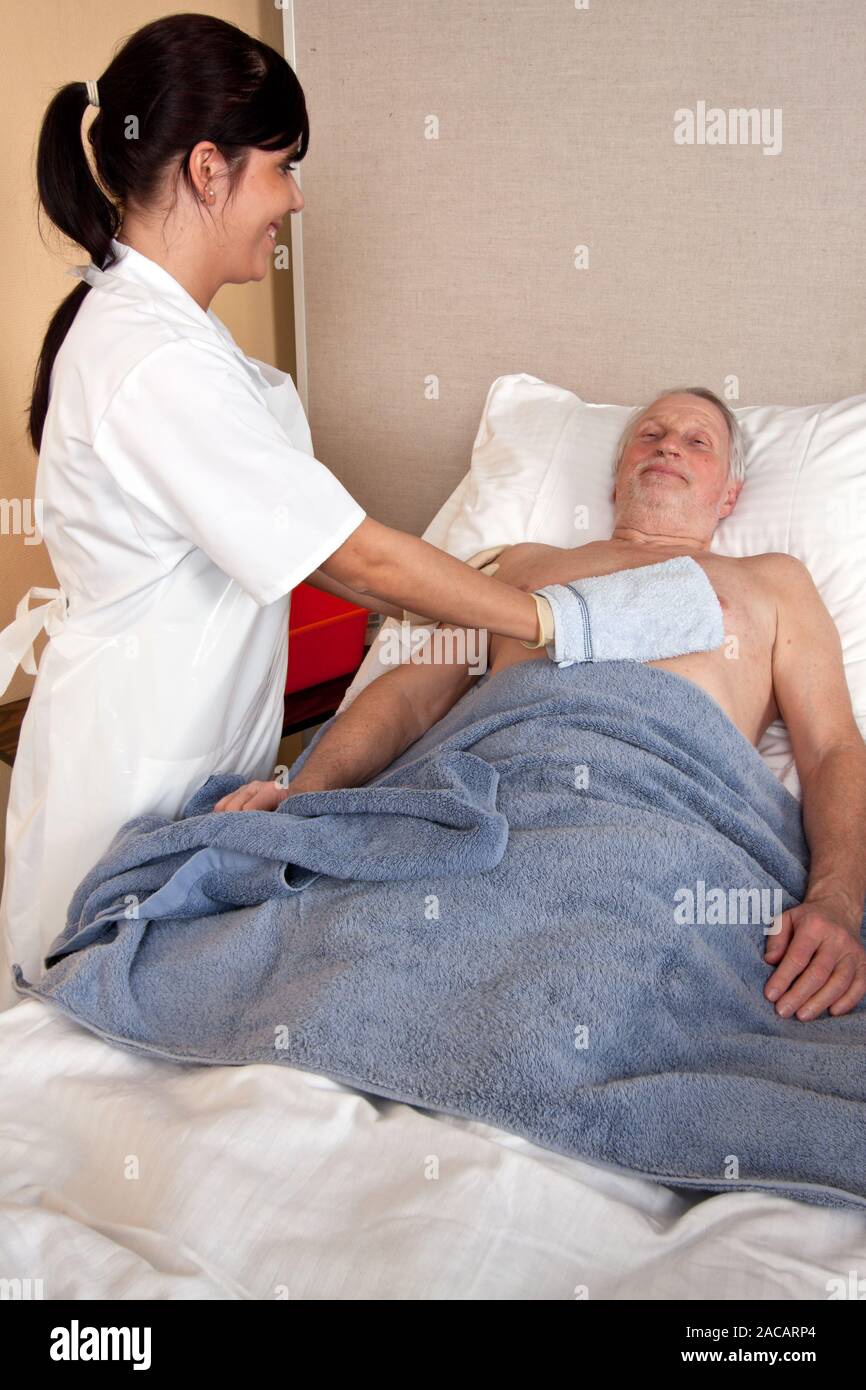 Nurse washes patient hi-res stock photography and images - Alamy