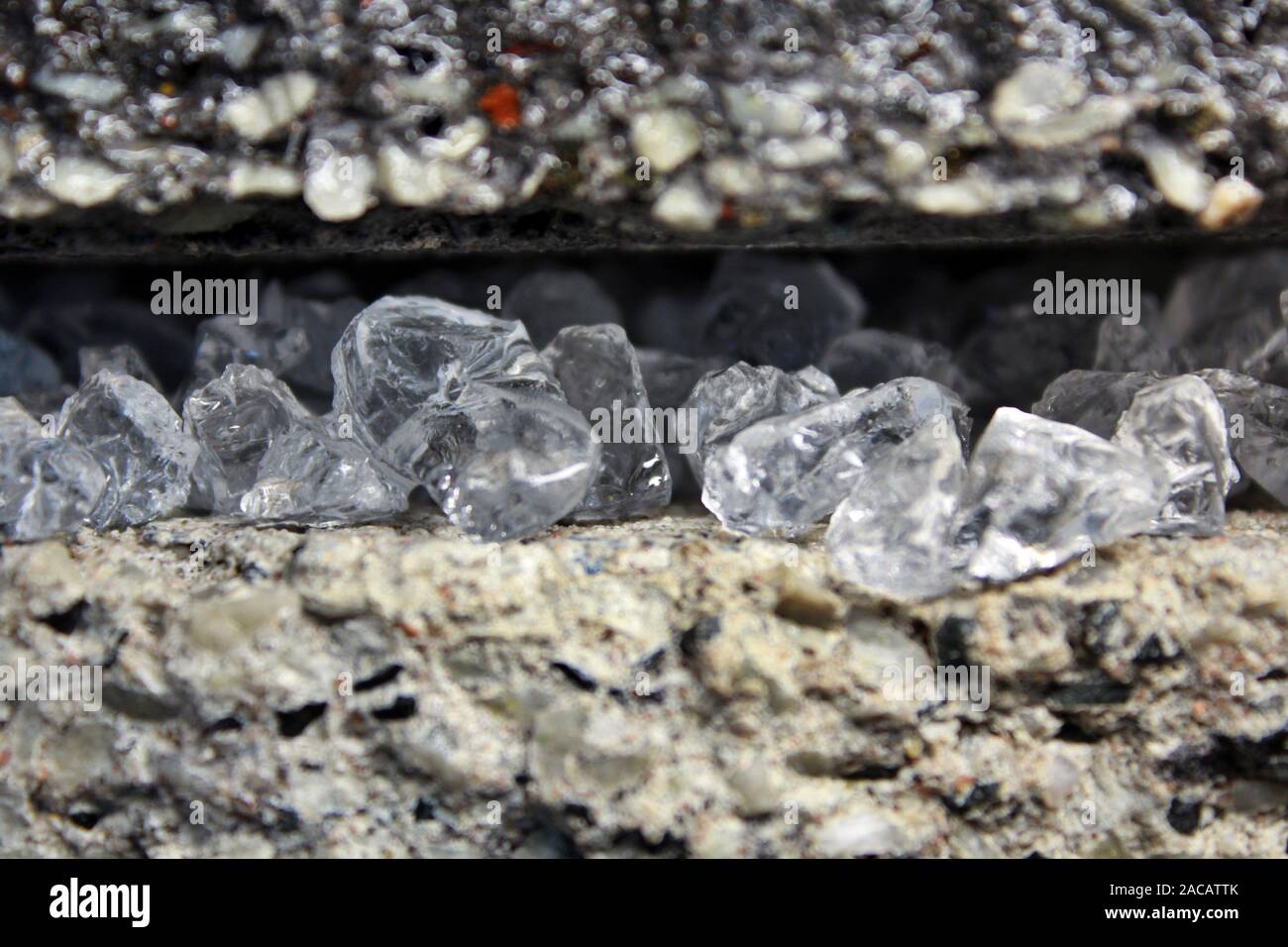 wet enclosed diamonds in stone, almost as in reality Stock Photo - Alamy