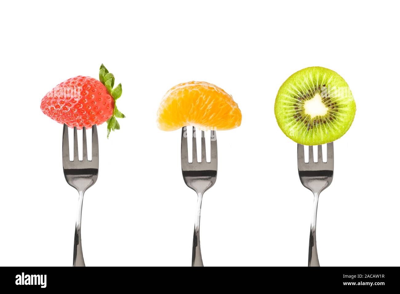 Forks with fruits isolated on white background Stock Photo - Alamy