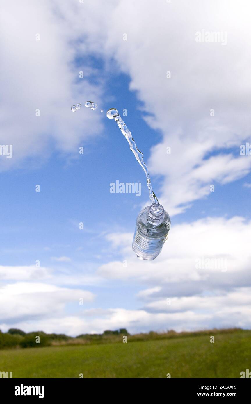 Water bottle flies in the air Stock Photo - Alamy