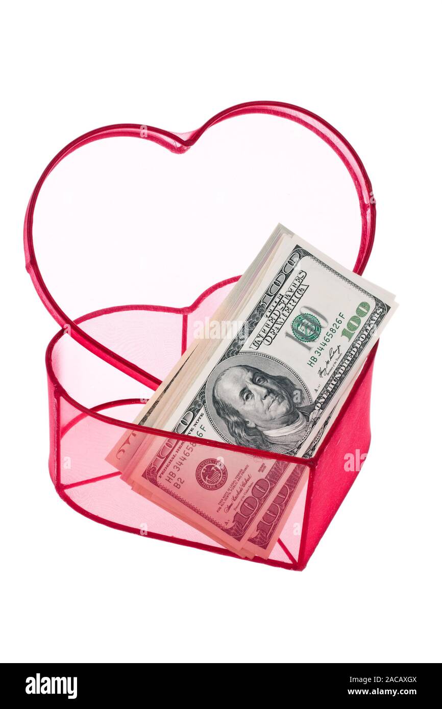 Dollar banknotes in a heart Stock Photo - Alamy