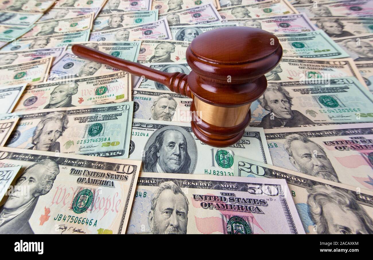 Dollar banknotes and judge's hammer Stock Photo - Alamy