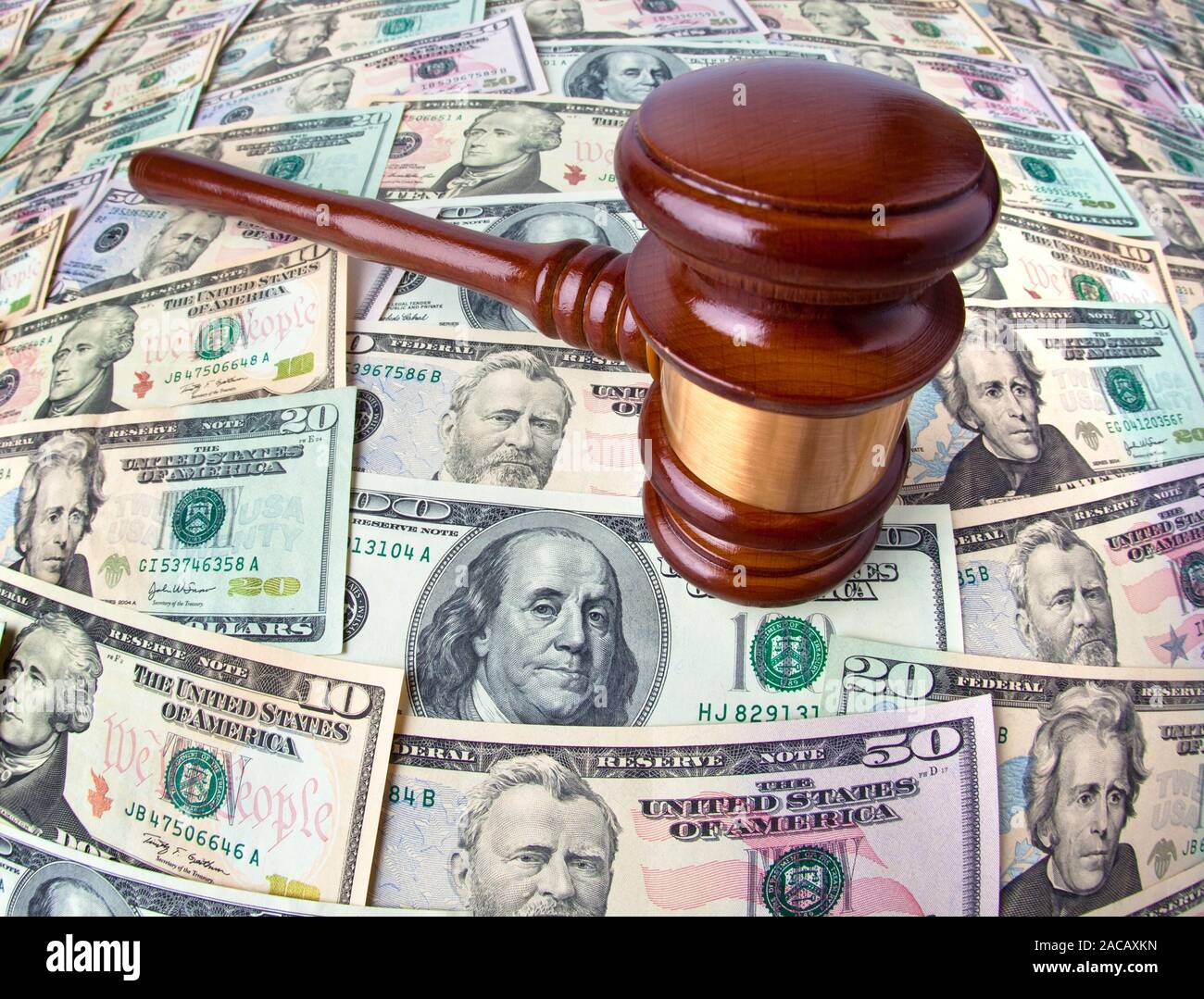 Dollar banknotes and judge's hammer Stock Photo - Alamy
