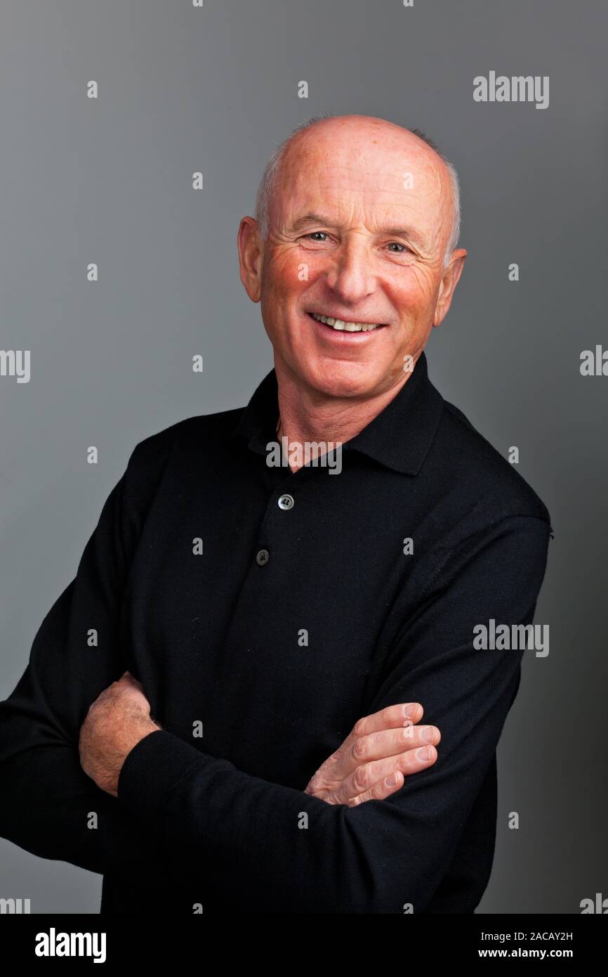 Portrait of a friendly elderly man Stock Photo - Alamy