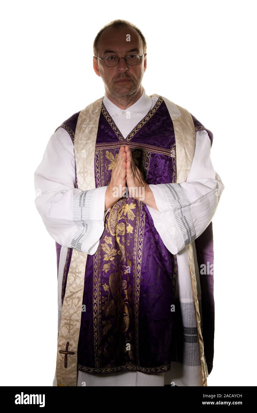 Catholic priest praying in divine service Stock Photo - Alamy