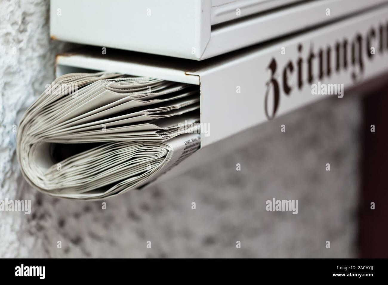 Newspaper in mailbox Stock Photo - Alamy