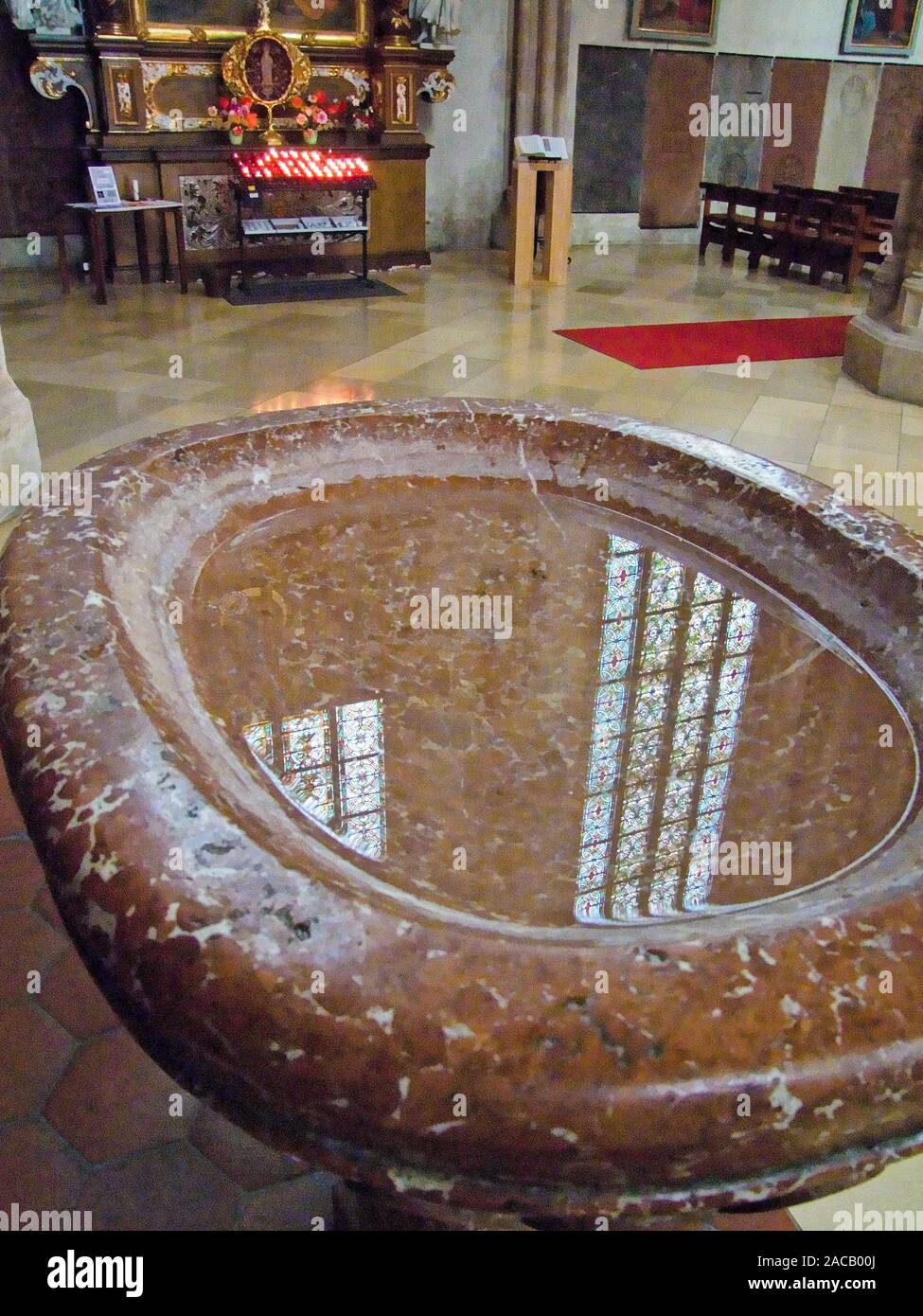 A vessel with holy water in a church Stock Photo - Alamy