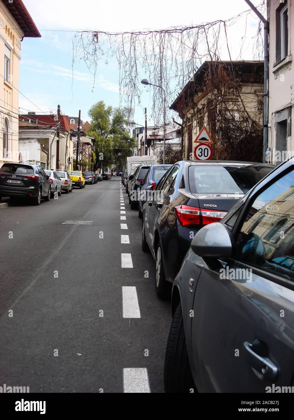 Cars parked along the street. Bucharest, Romania, 2019 Stock Photo - Alamy