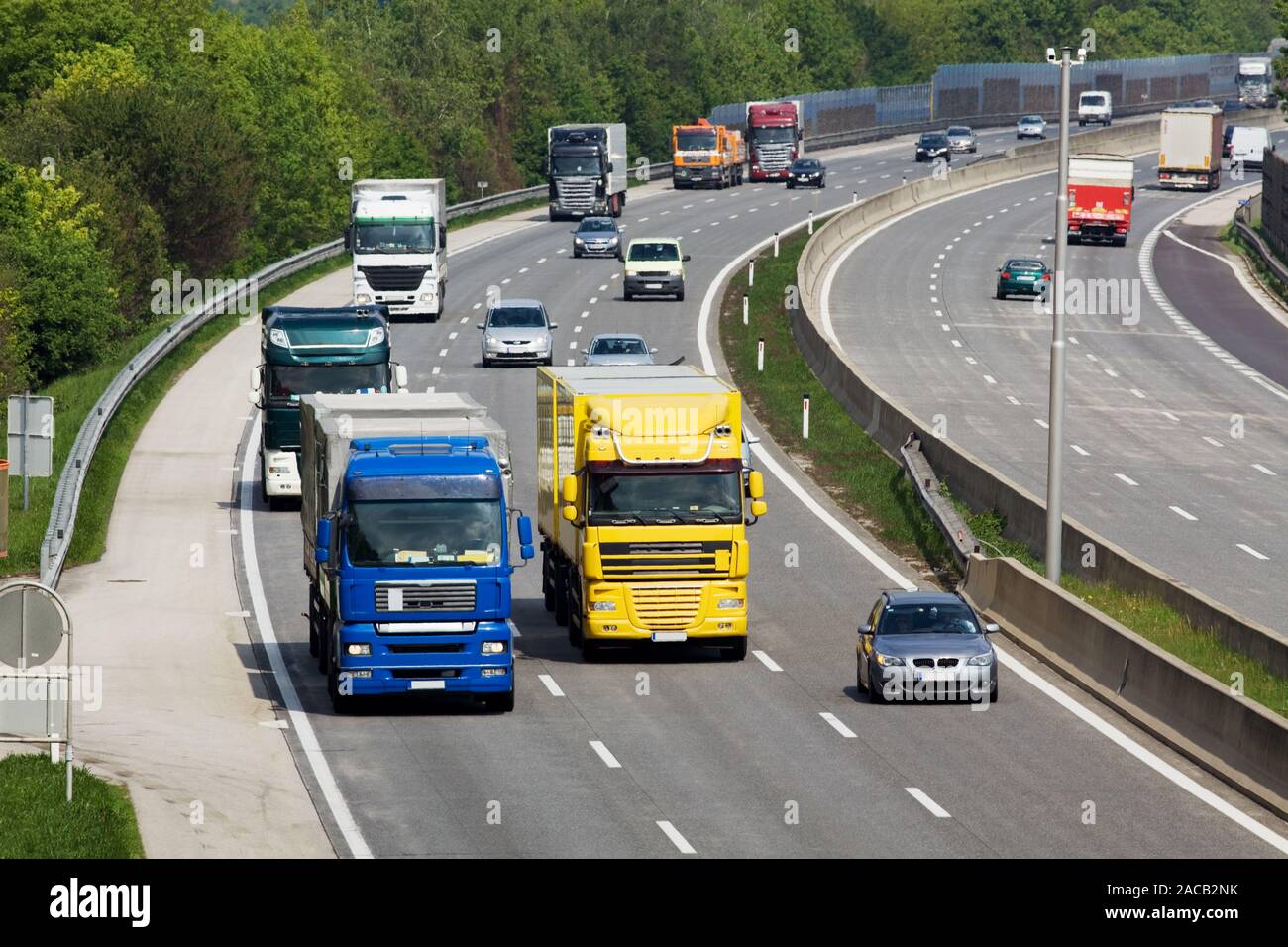 Motorway with cars and trucks Stock Photo - Alamy