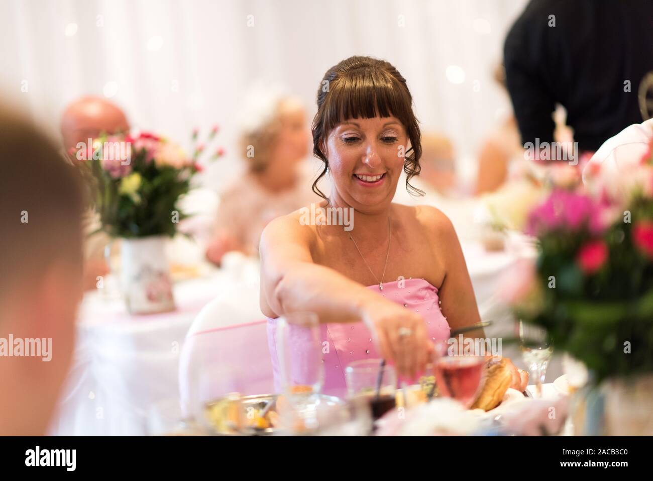 Wedding guests smiling, laughing and having fun at the wedding ...