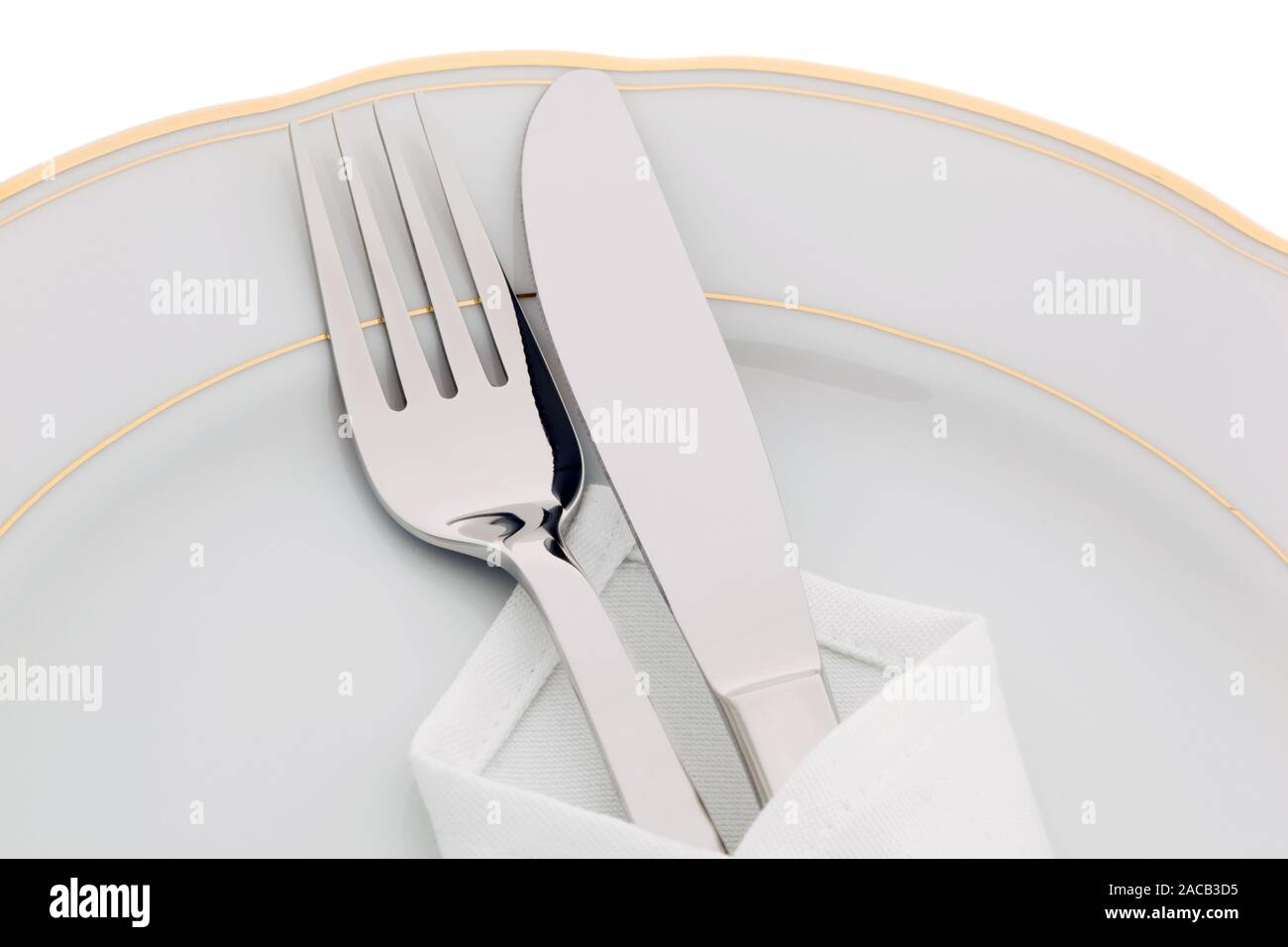 Knife, fork and plate Stock Photo - Alamy