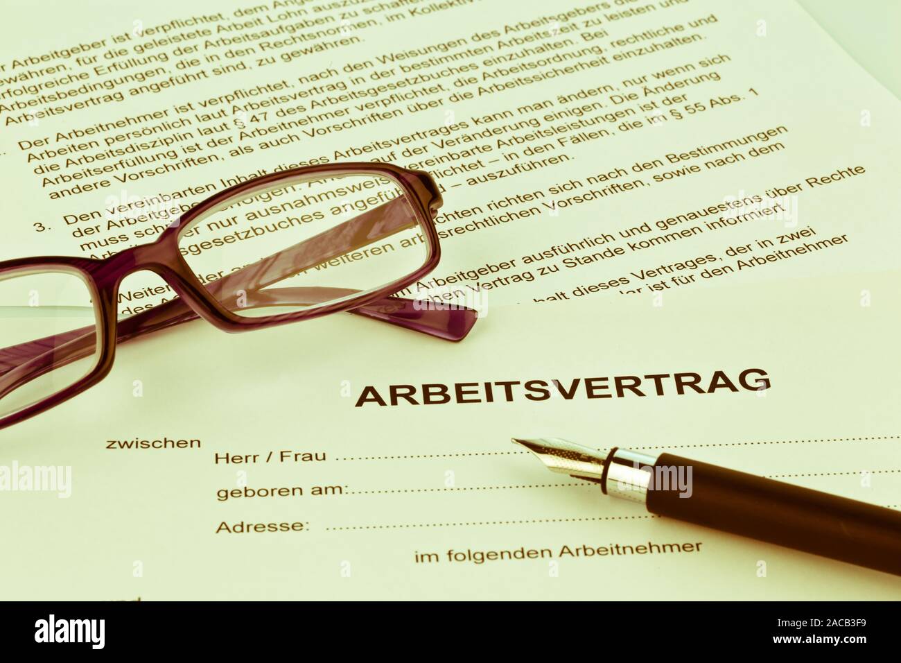 Employment contract in German language Stock Photo - Alamy