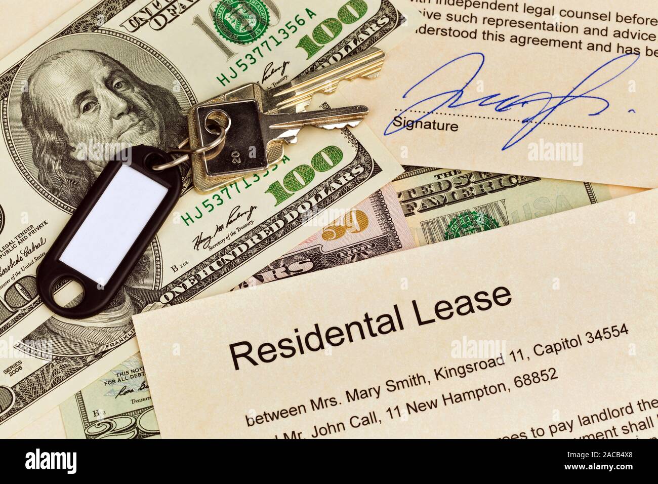 Key to apartment and tenancy agreement Stock Photo - Alamy