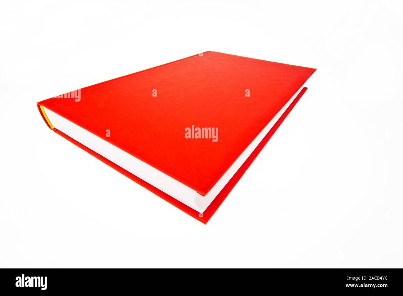 Red book on white background Stock Photo - Alamy