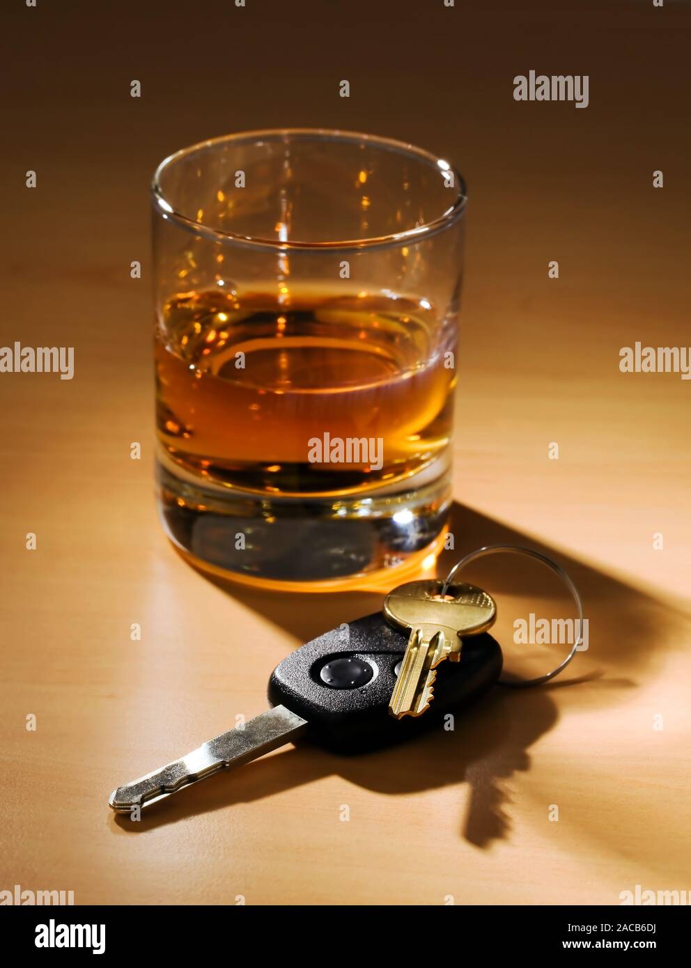 Car keys and glass with alcohol Stock Photo - Alamy