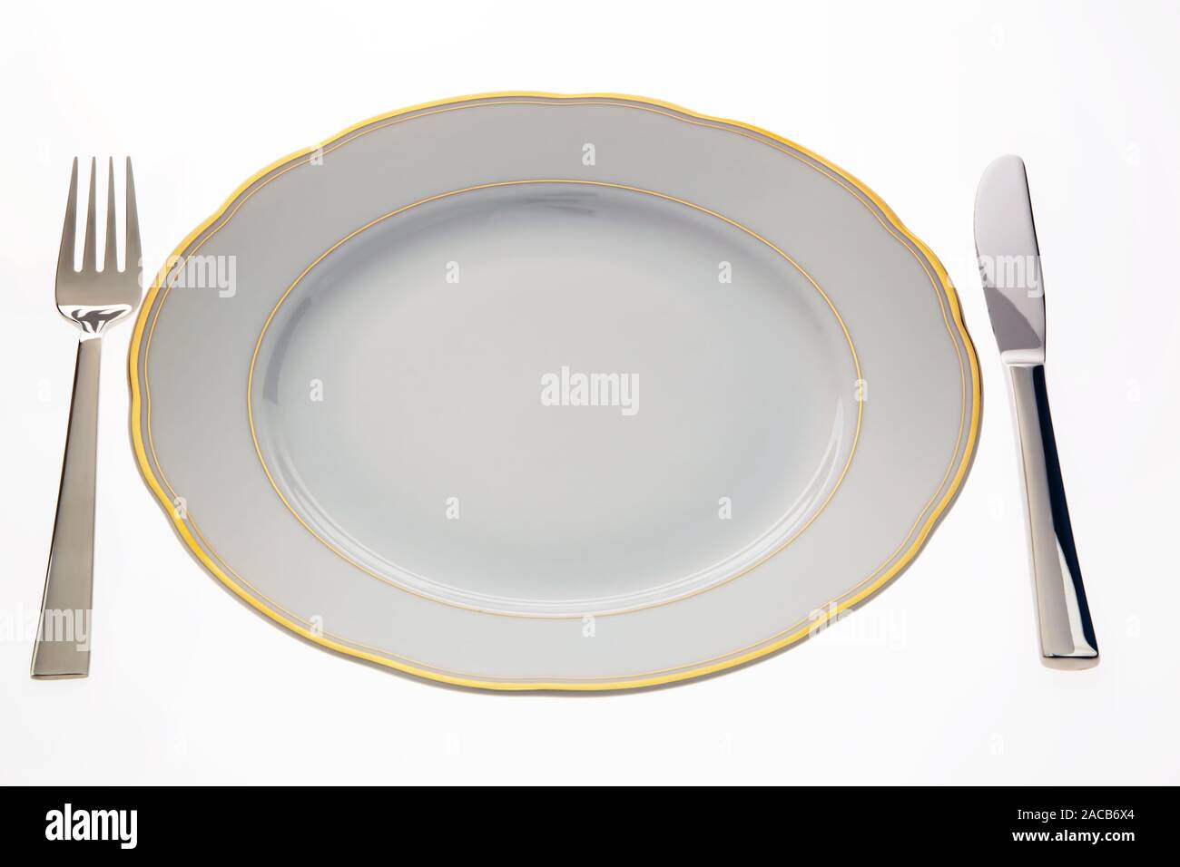 Knife, fork and plate Stock Photo - Alamy