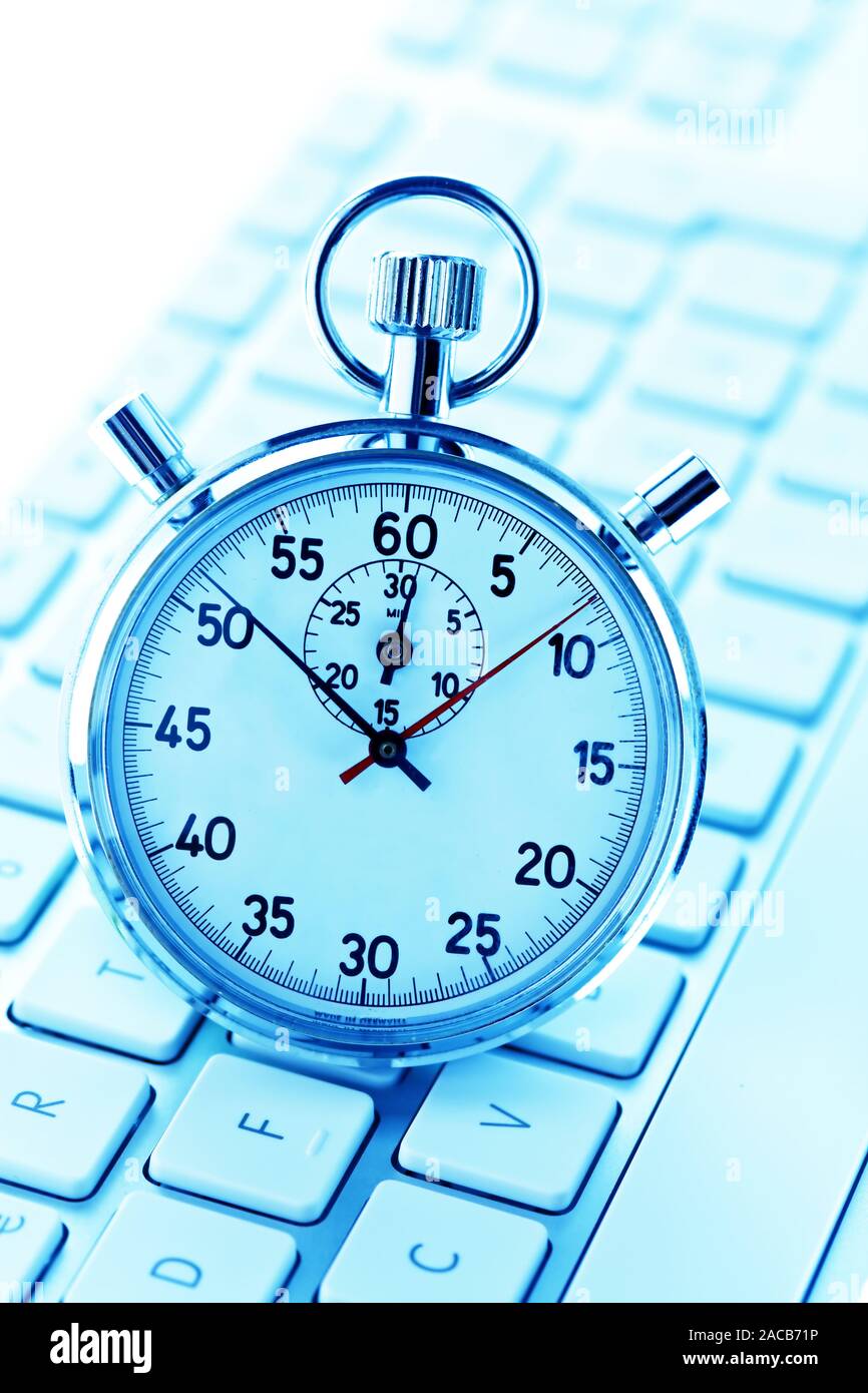 Stopwatch and Computer Keyboard Stock Photo - Alamy