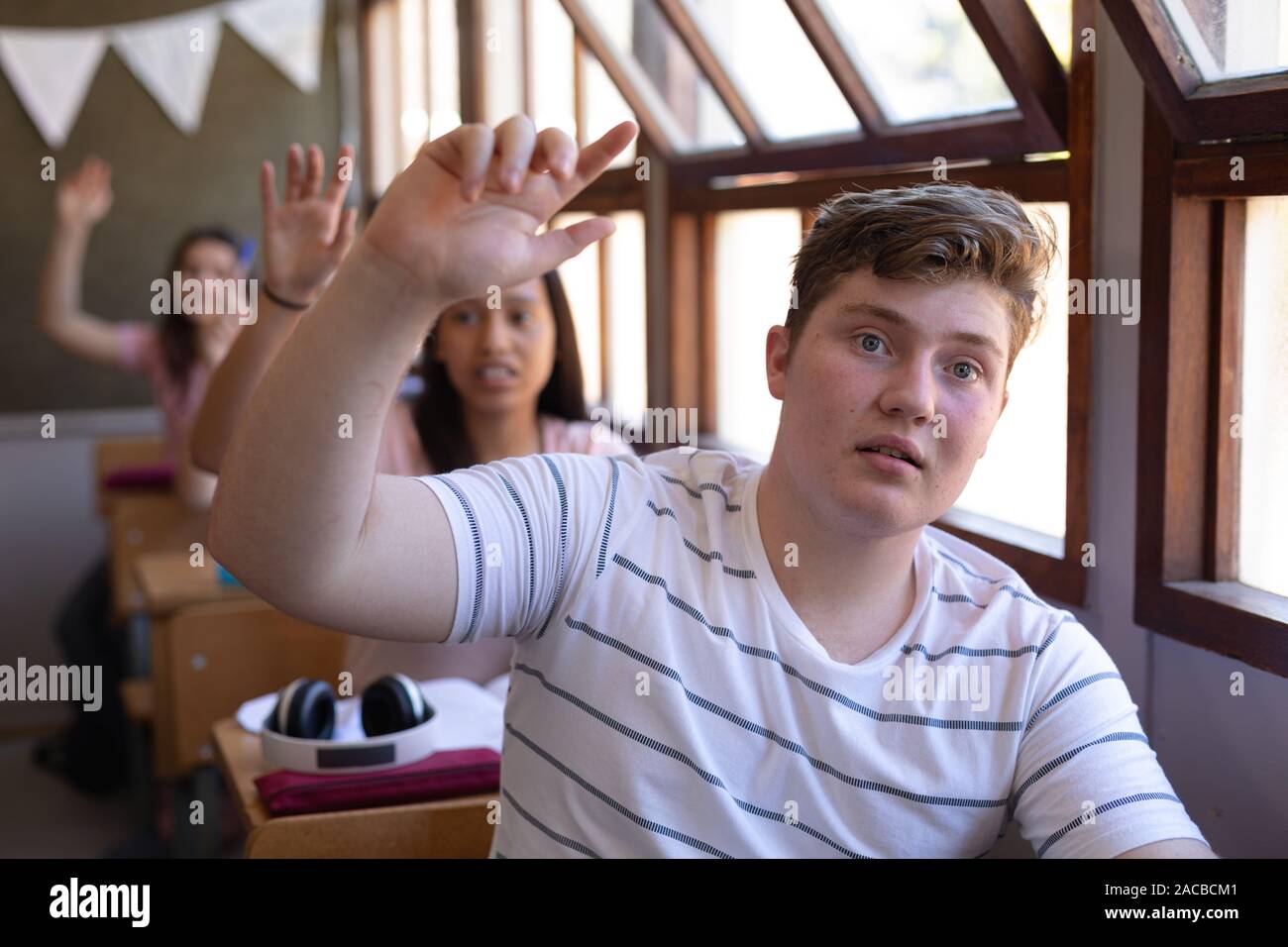 Teenagers in school classroom Stock Photo - Alamy