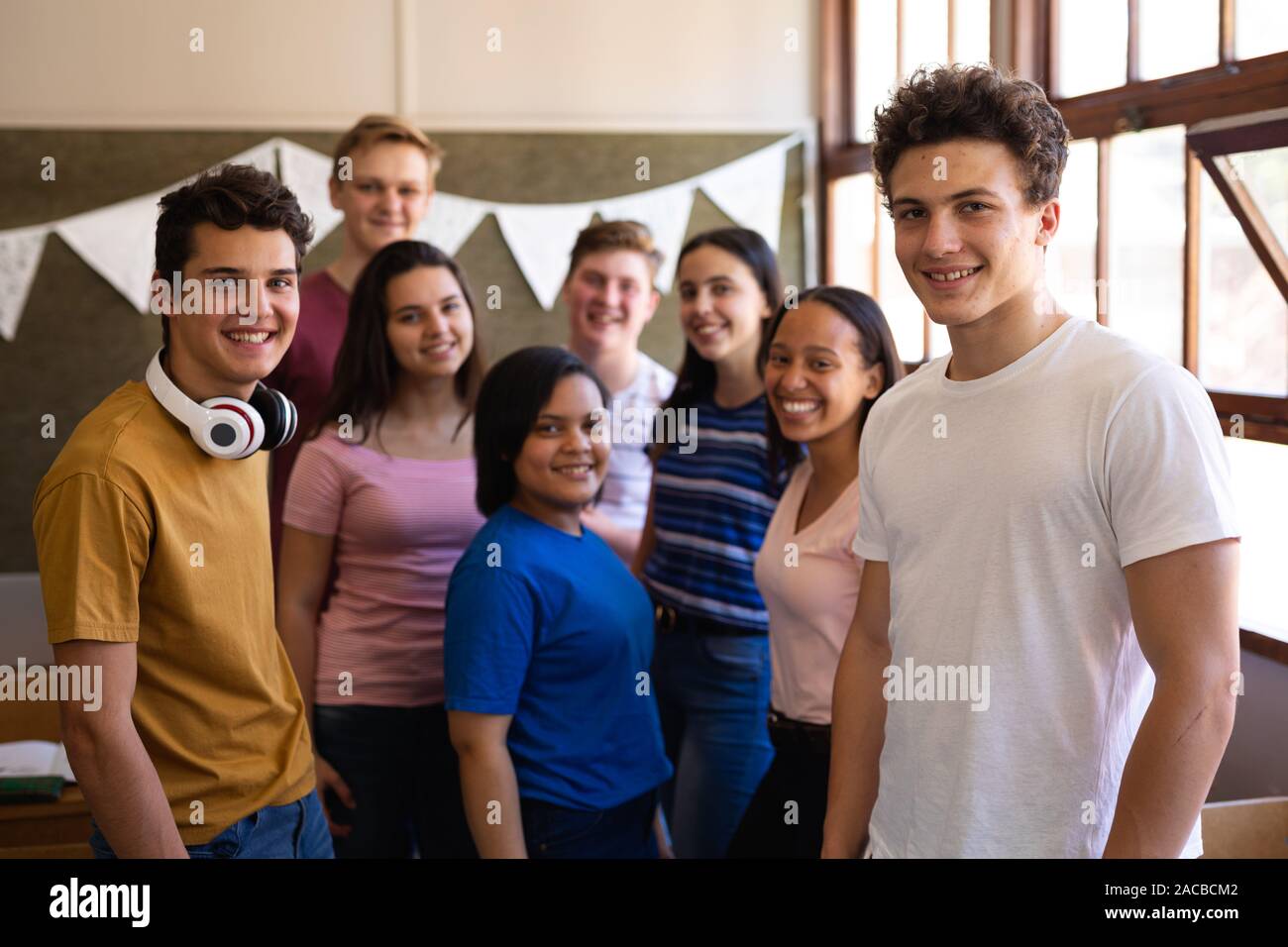 Teenagers in school classroom Stock Photo - Alamy