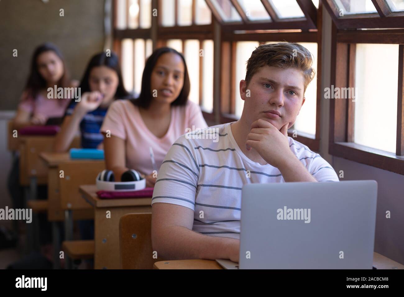 Teenagers in school classroom Stock Photo - Alamy