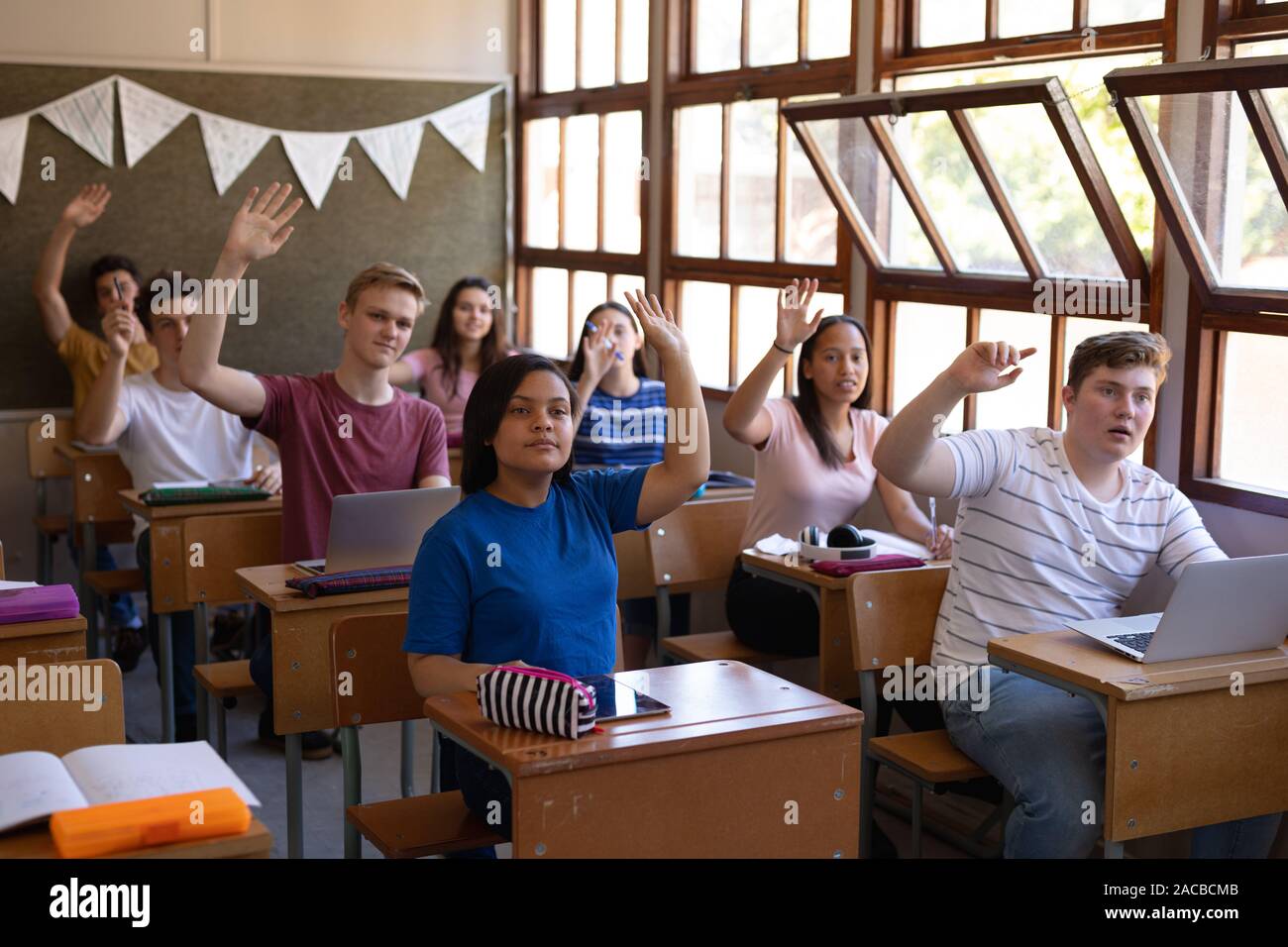 Teenagers in school classroom Stock Photo - Alamy