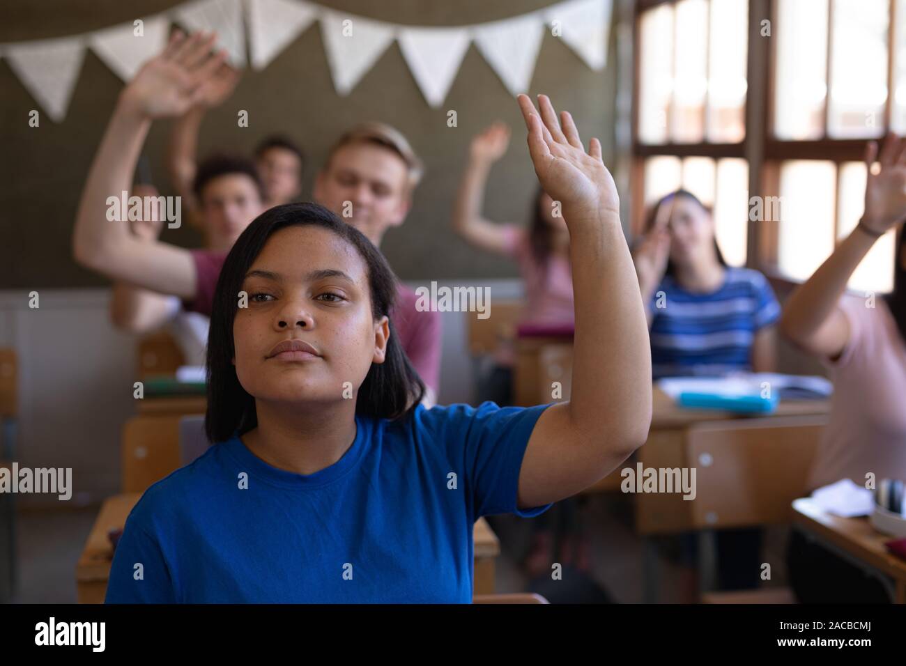 Teenagers in school classroom Stock Photo - Alamy