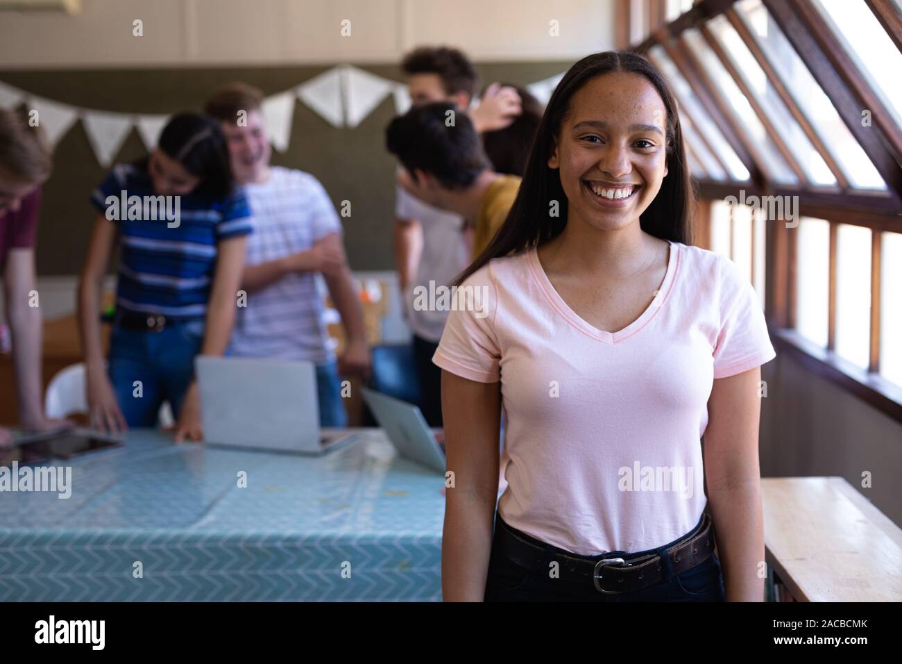 Portrait of teenage girl in school classroom Stock Photo - Alamy