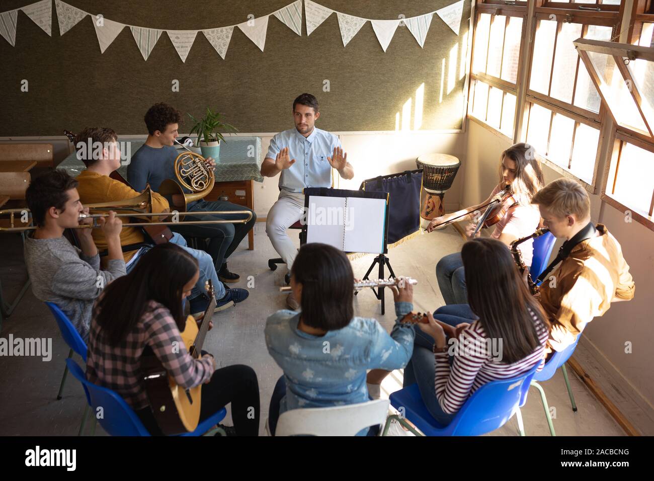 Teenage musicians rehearsing Stock Photo - Alamy