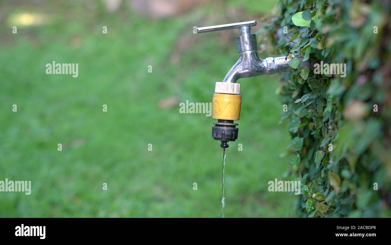 Exterior tap water dripping. Save water or hot summer concept Stock ...