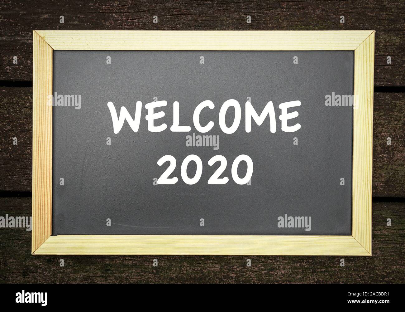 Welcome 2020, typed white text on black board Stock Photo - Alamy