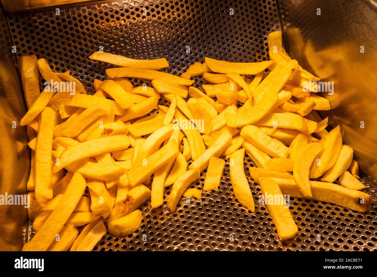 Cooked chips in a fish and chip shop in the United Kingdom Stock Photo ...
