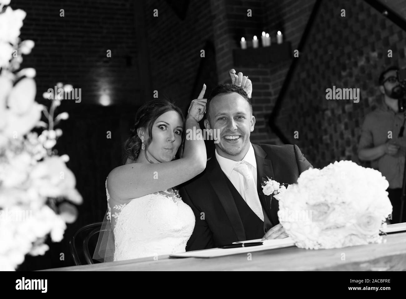 A bride and groom smiling, laughing together happy and in love on their ...