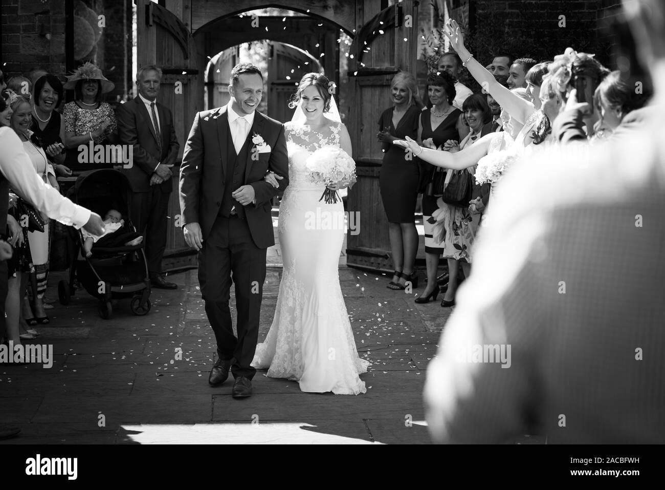 A bride and groom smiling, laughing together happy and in love on their ...